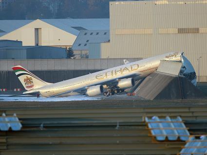 PICTURE: Etihad A340-600 jumps chocks, hits wall; 5 injured | News ...