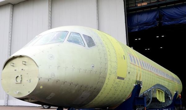 SSJ-New fuselage emerges from production line during transfer to Moscow ...