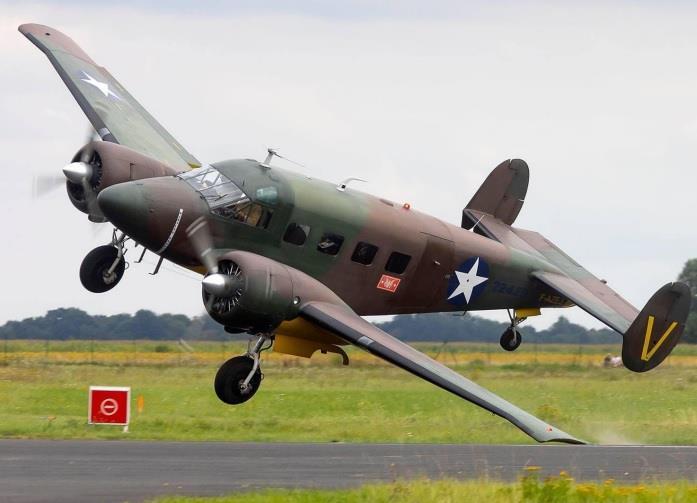 Wake and tailwind led to Beech 18 wing-strike and excursion at air show ...